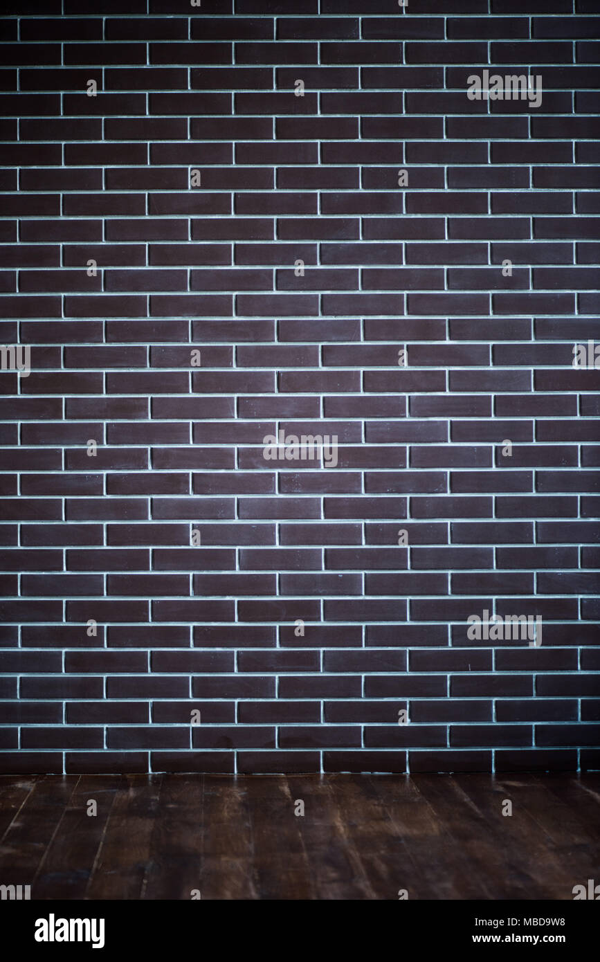 background of a brick dark wall, tile texture with a smooth pattern ...
