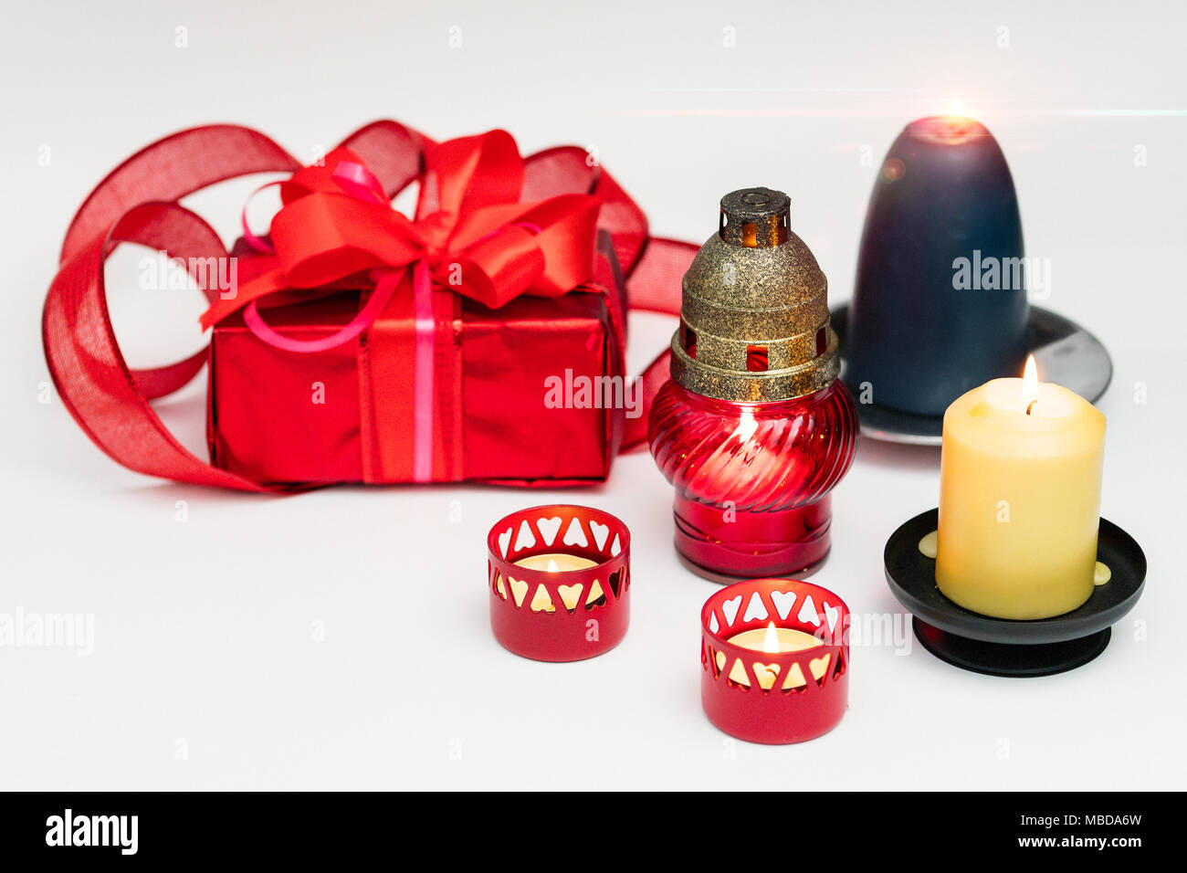 Candles red ribbon hi-res stock photography and images - Alamy