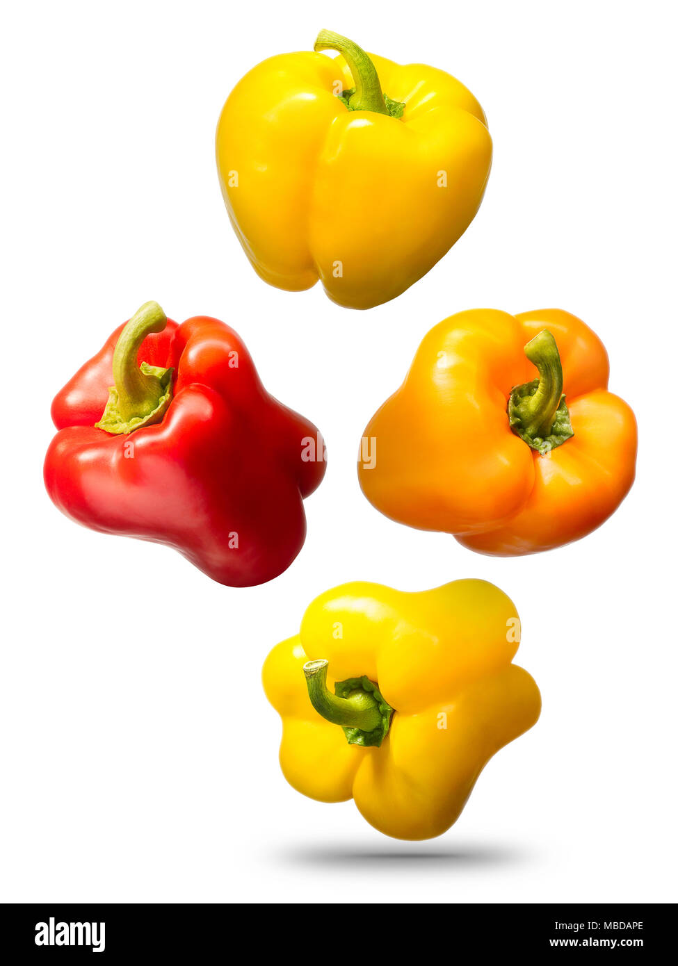 Falling bell peppers isolated on white background Stock Photo - Alamy