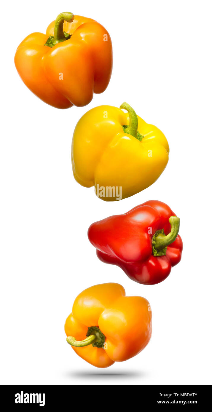 Falling bell peppers isolated on white background Stock Photo - Alamy