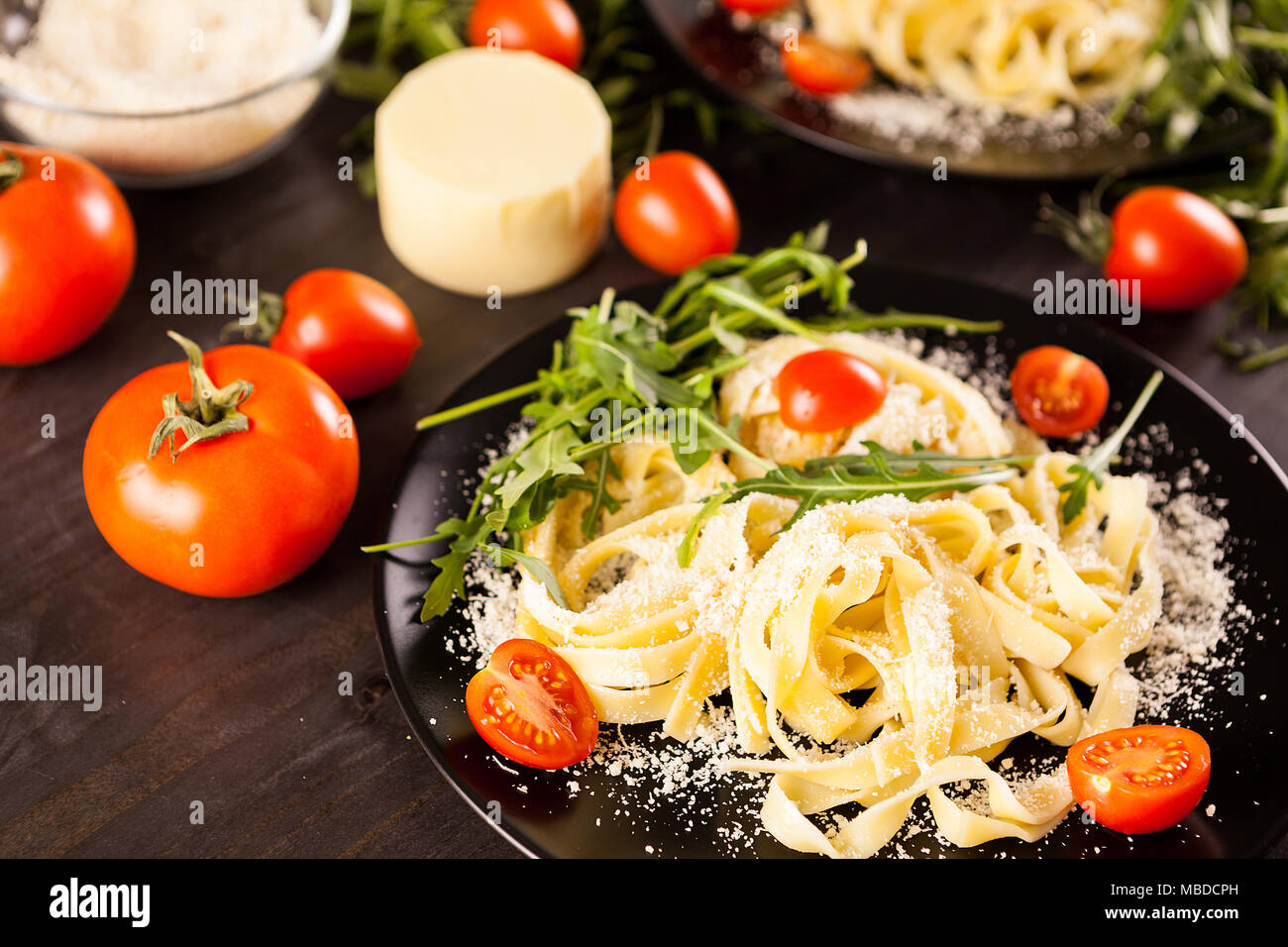 Pasta bolognese in black plate hi-res stock photography and images - Alamy