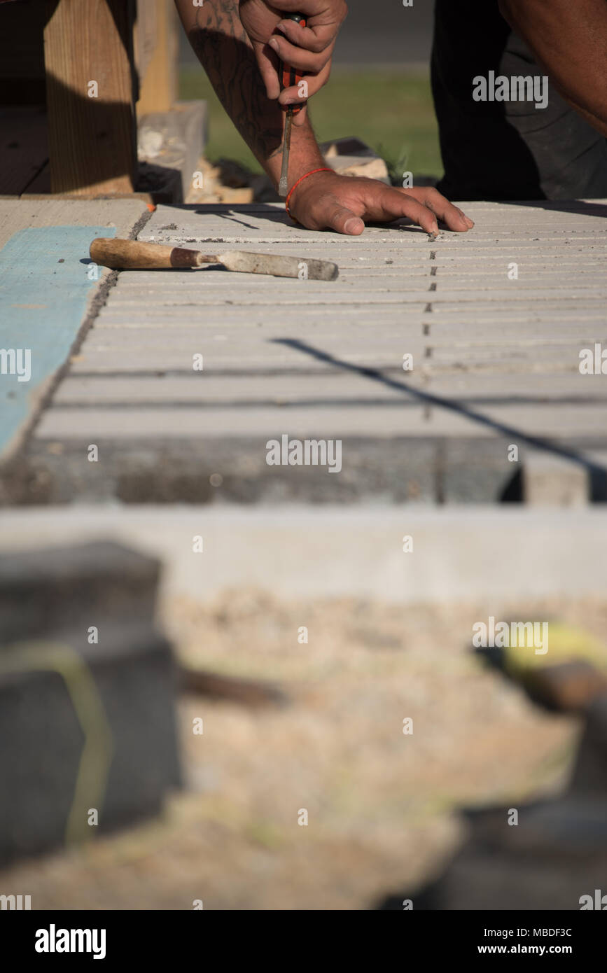 Worker using tools laying hi-res stock photography and images - Alamy