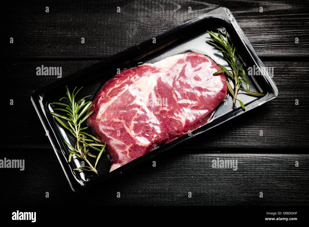 Raw steak in an airtight packaging Stock Photo - Alamy