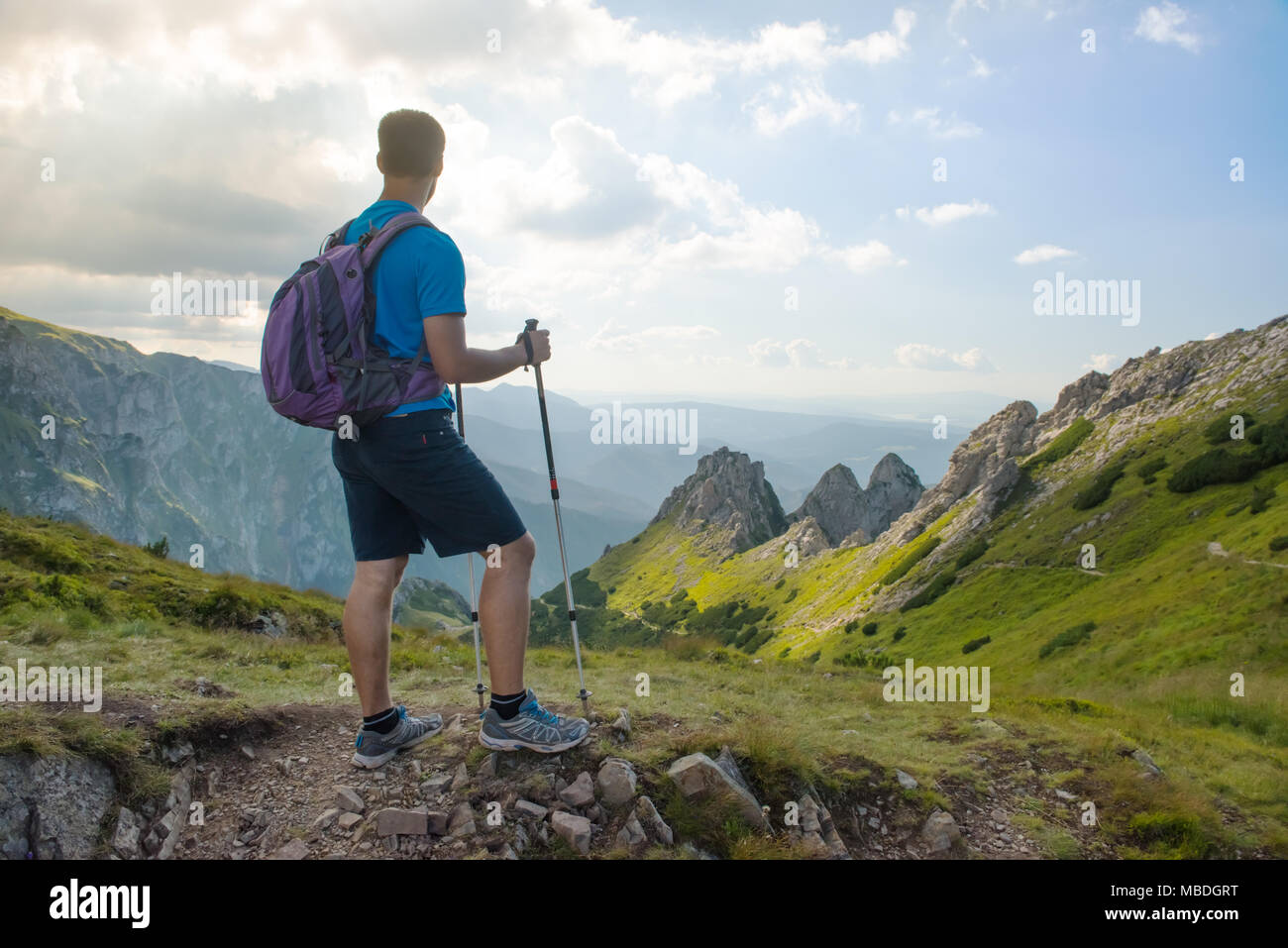 man hiker on top of mountain Stock Photo - Alamy