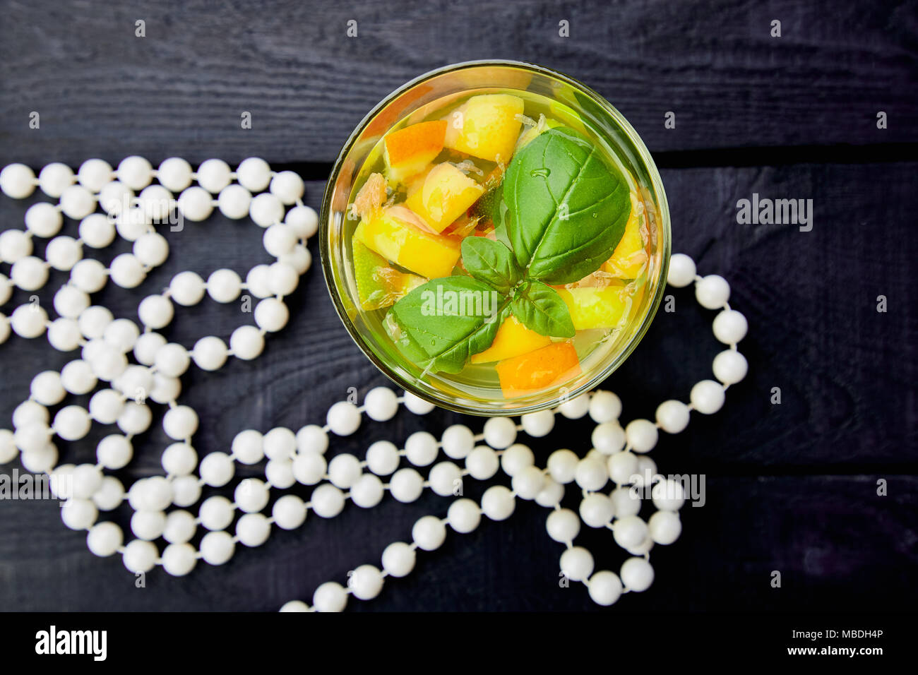 Fresh Detox water with citrus on black wooden background. Lemonade with ...
