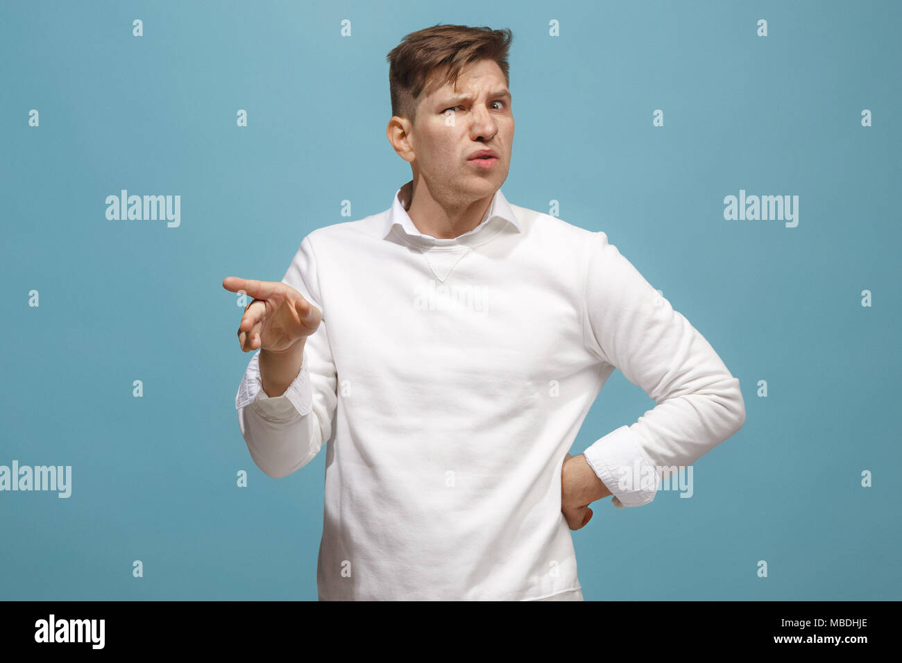 Disgusted young man with funny expression hi-res stock photography and ...