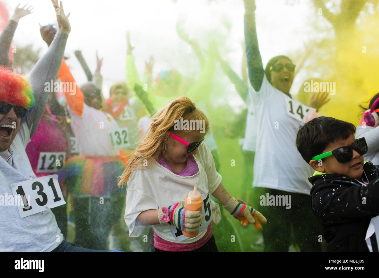 Standing holding childhood smiling crowd hi-res stock photography and ...