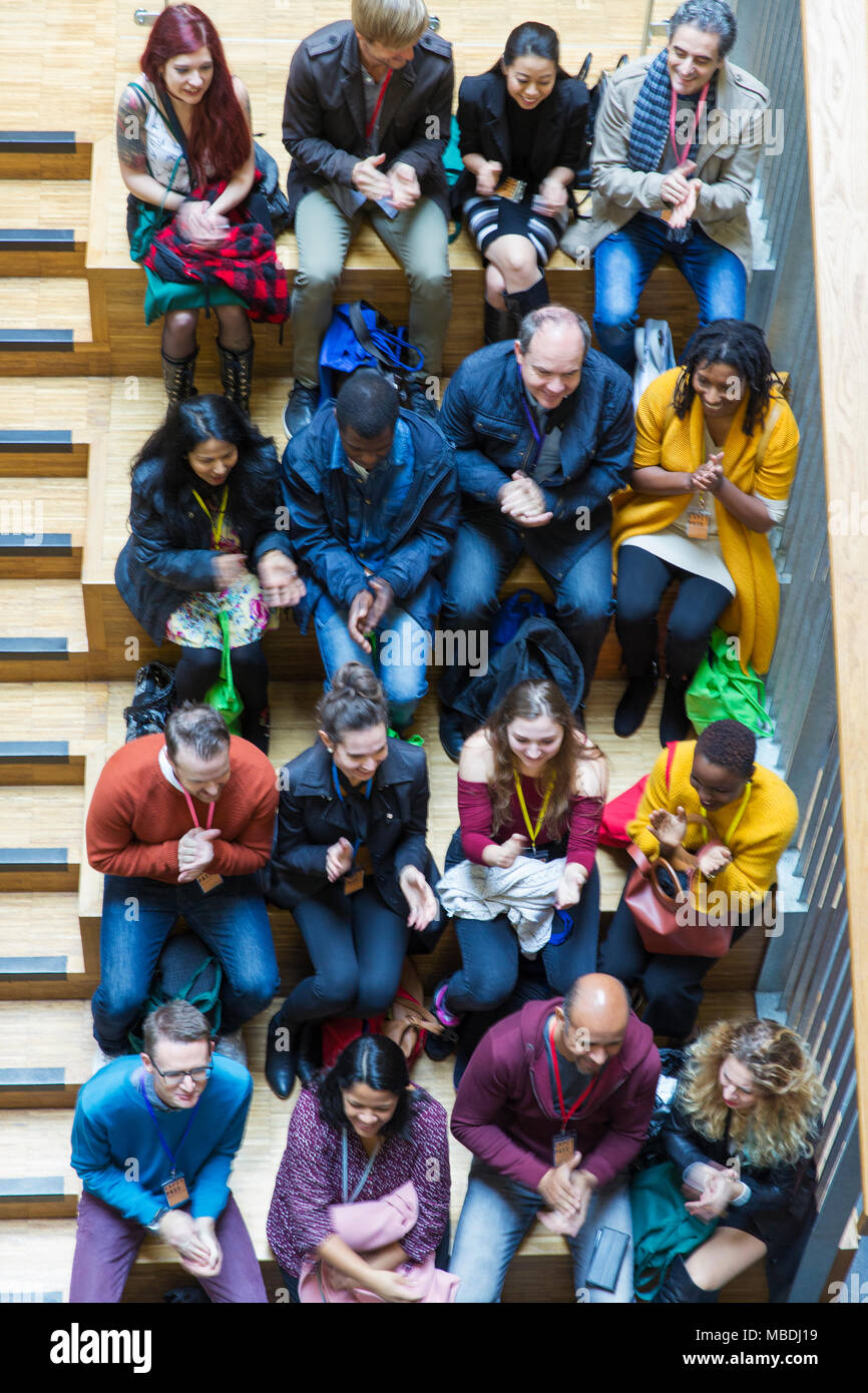 Overhead view clapping conference audience Stock Photo - Alamy