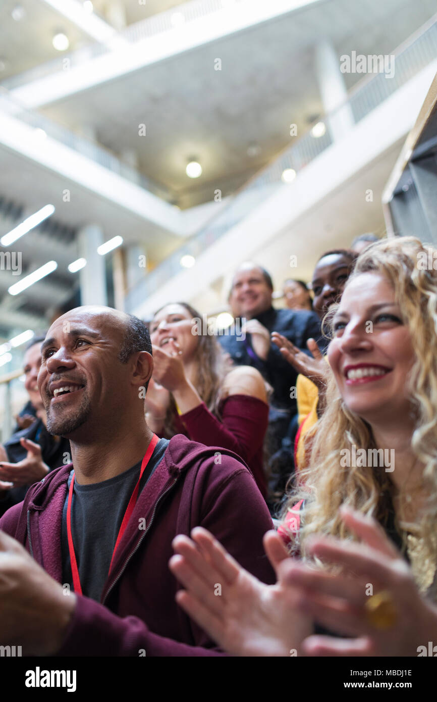 Smiling people clapping in conference audience Stock Photo - Alamy