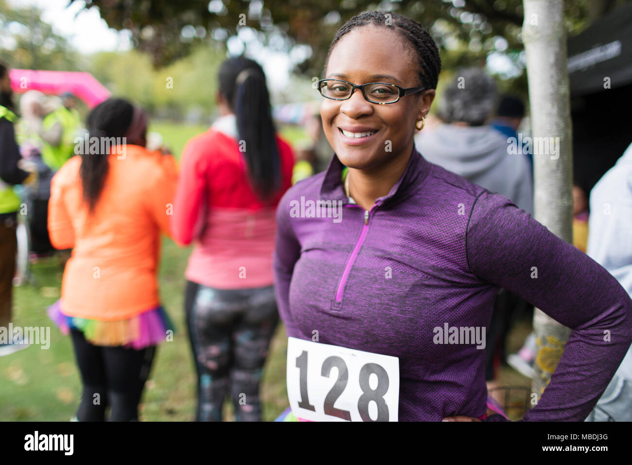 Portrait smiling, confident female runner at charity run Stock Photo ...