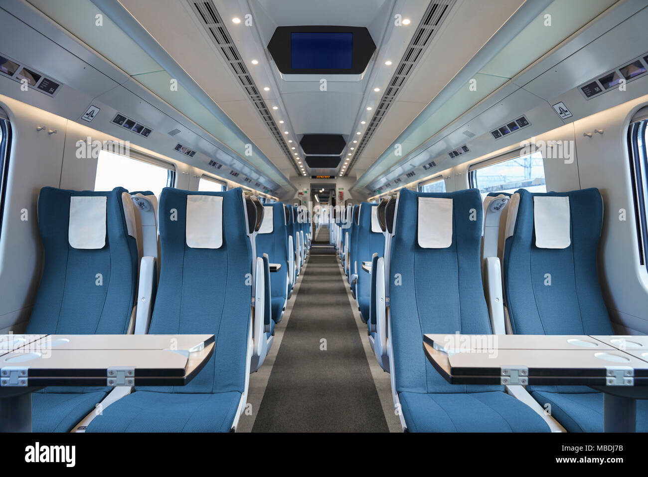 Seats in empty passenger train Stock Photo - Alamy