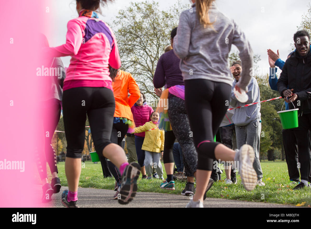 Marathon runners running in park Stock Photo - Alamy
