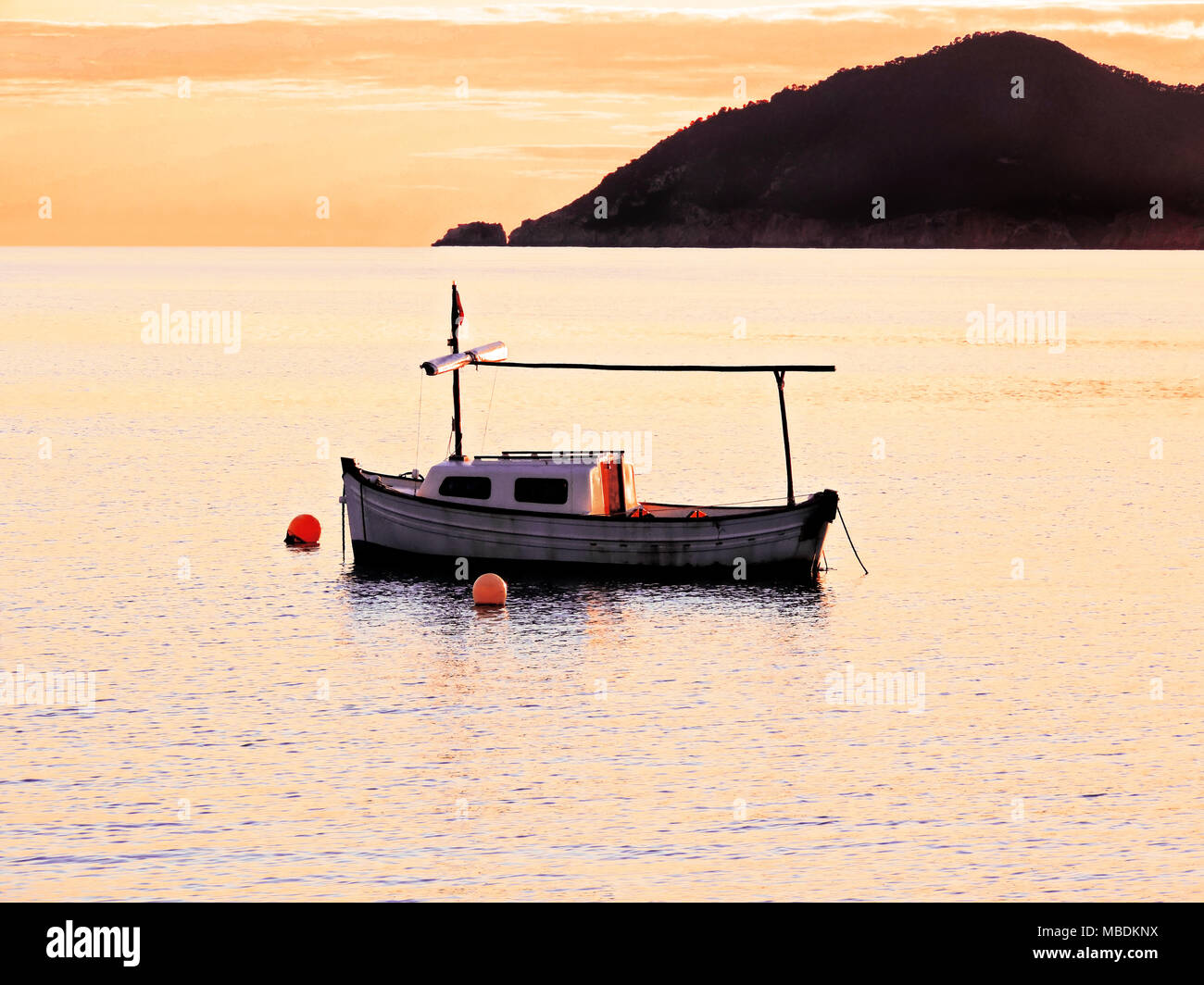Sundown with fisherboat hi-res stock photography and images - Alamy