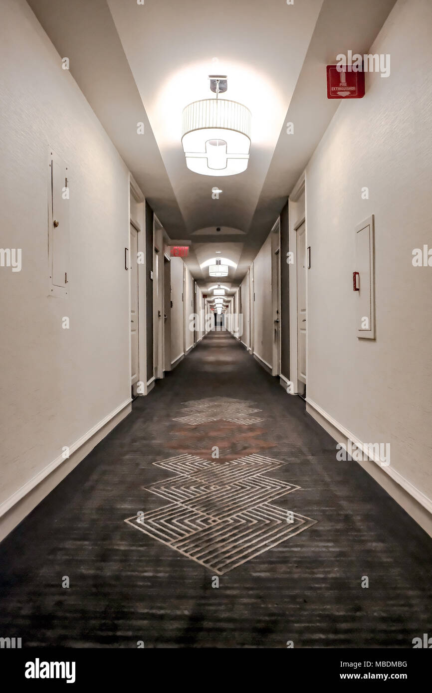Abstract view of an empty hotel lobby and corridor showing the tunnel ...