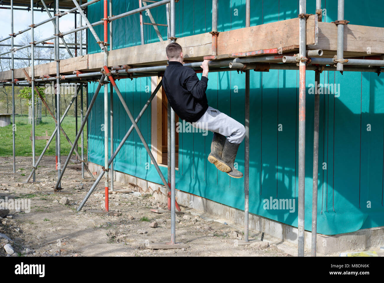 Scaffolding framework around a modern timber framed building Stock ...