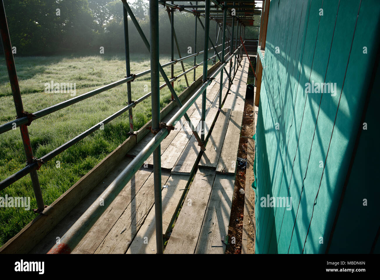 Scaffolding framework around a modern timber framed building Stock ...