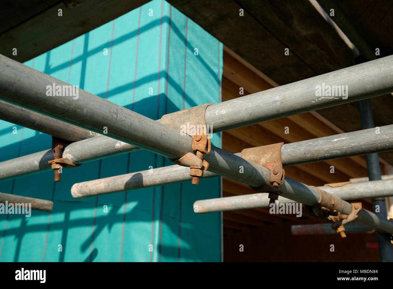 Scaffolding framework around a modern timber framed building Stock ...