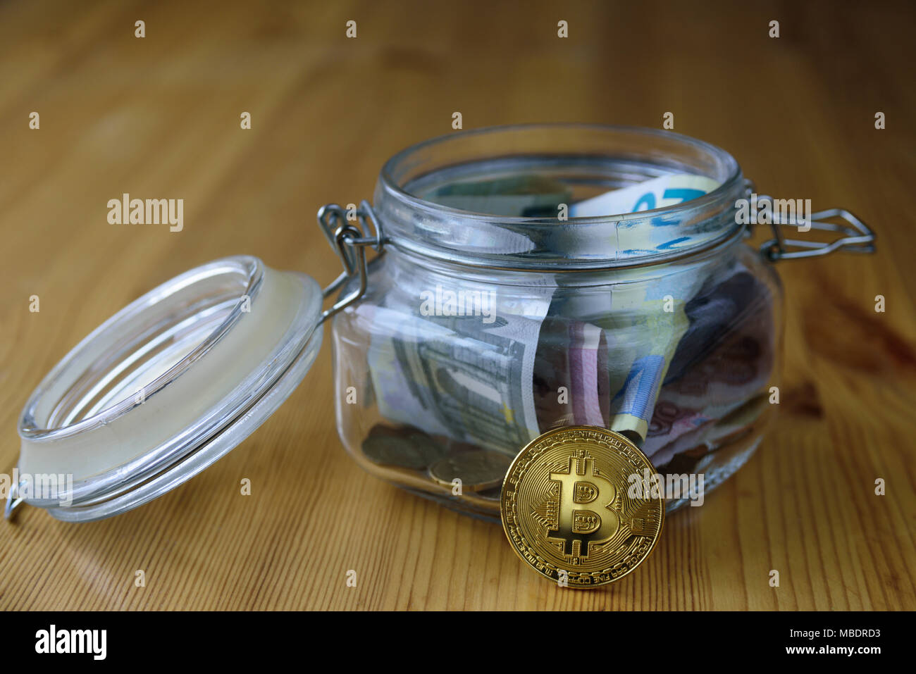 Money jar hand hi-res stock photography and images - Alamy