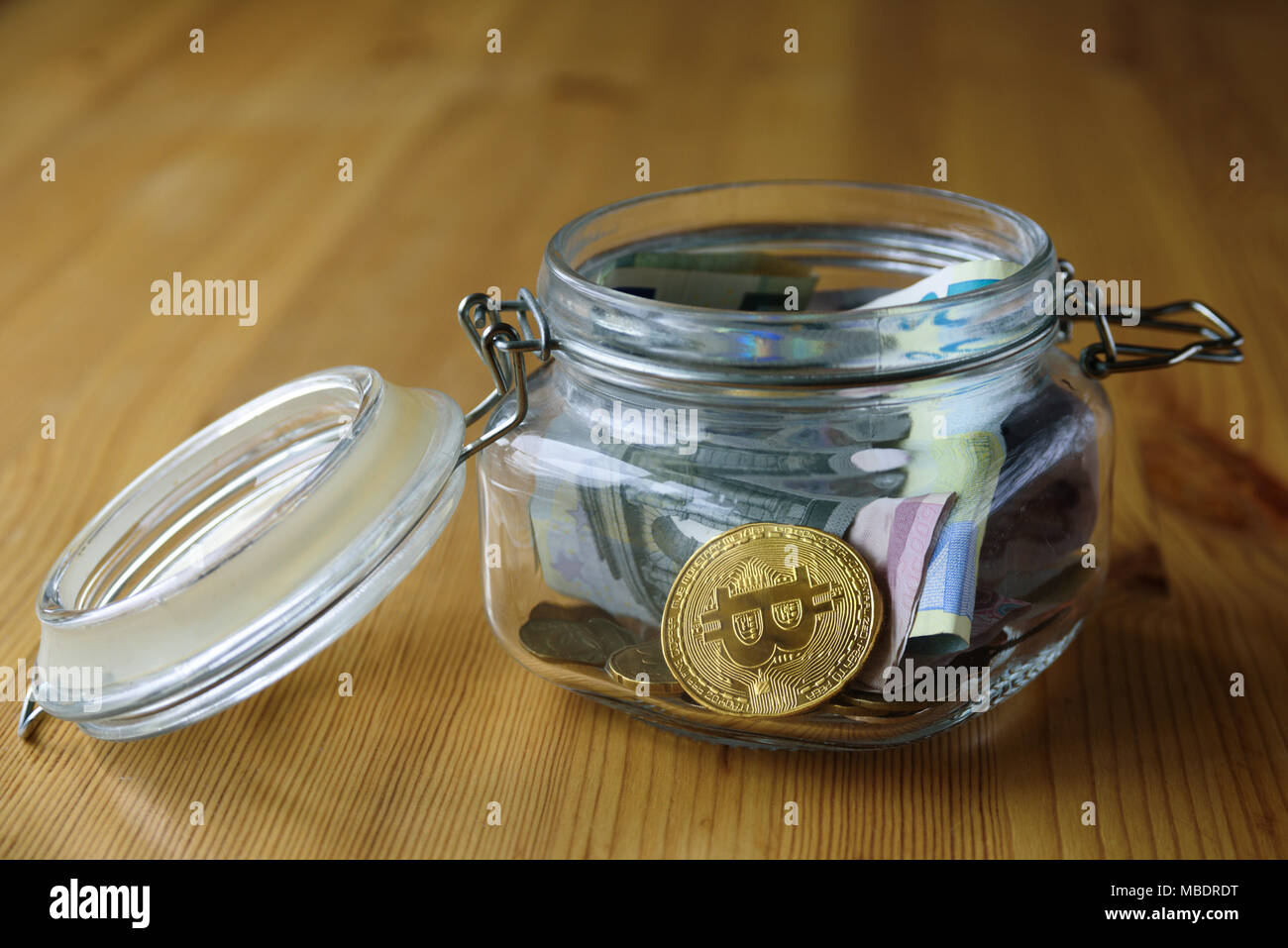 Money jar hand hi-res stock photography and images - Alamy