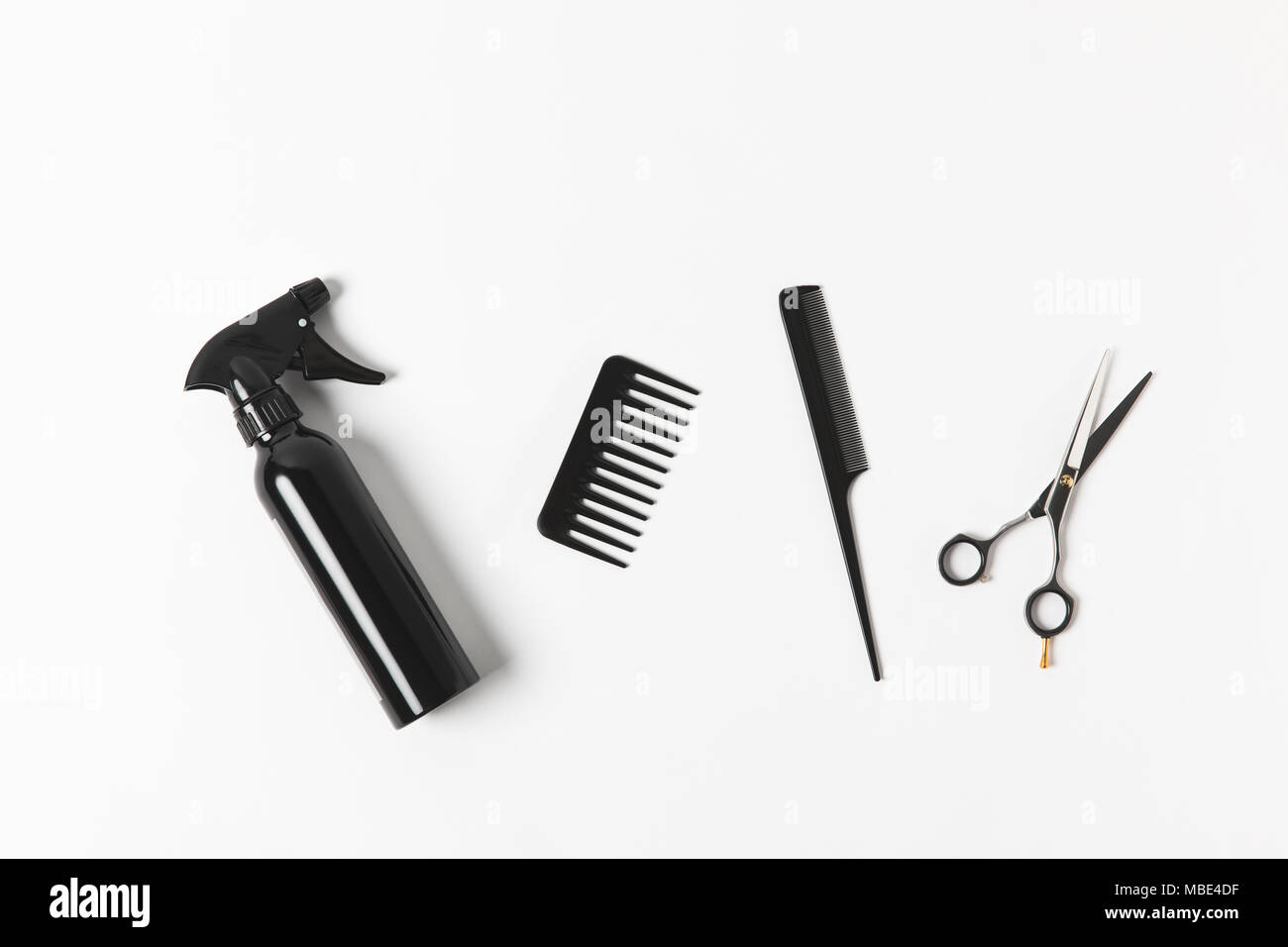 top view of spray bottle, combs and scissors, on white Stock Photo - Alamy