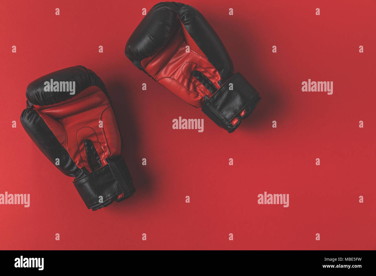 top view of boxing gloves lying on red tabletop Stock Photo - Alamy