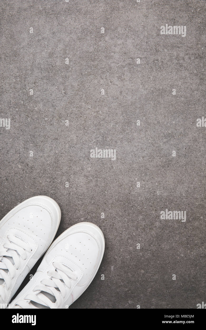 top view of stylish white shoes on concrete surface Stock Photo - Alamy