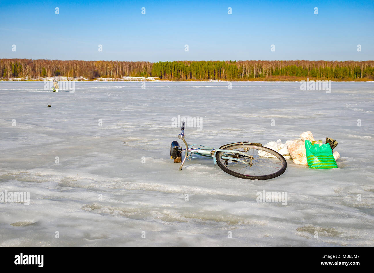 Abandoned bike on ice Stock Photo - Alamy