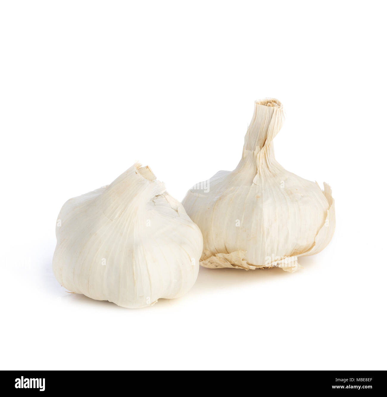 Two clove garlic on white background Stock Photo - Alamy