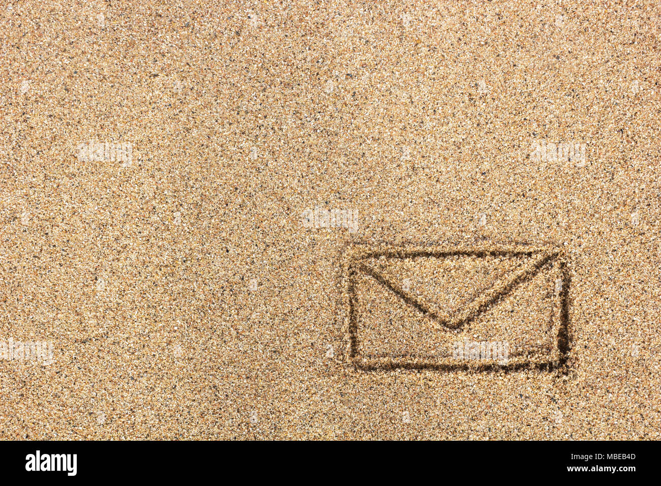 Sign letters drawn in the sand Stock Photo - Alamy