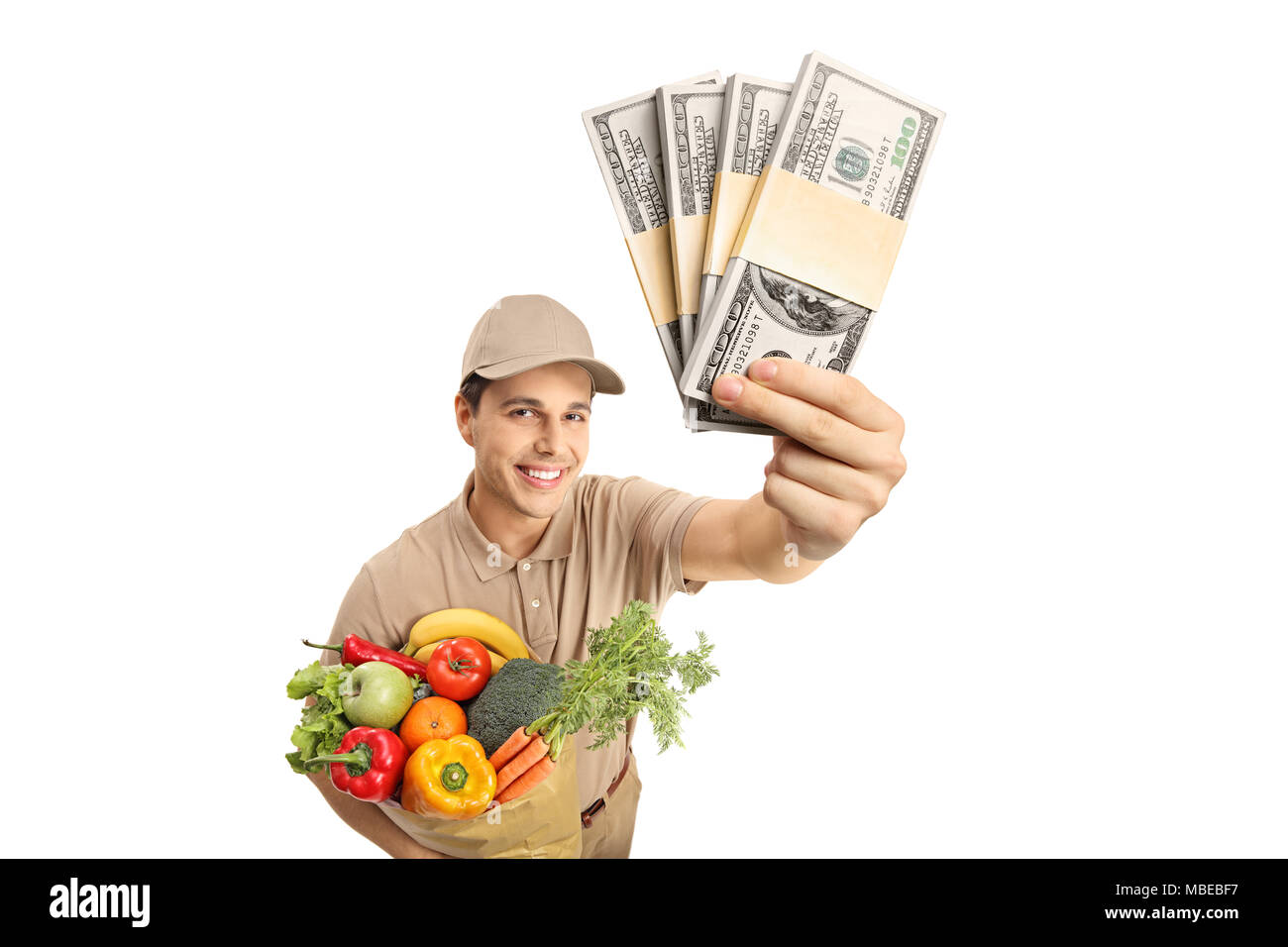 Delivery man holding a bag of groceries and bundles of money isolated ...