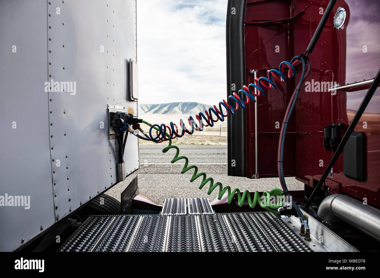 Power cables connecting the cab and the trailer of a class 8 commercial ...