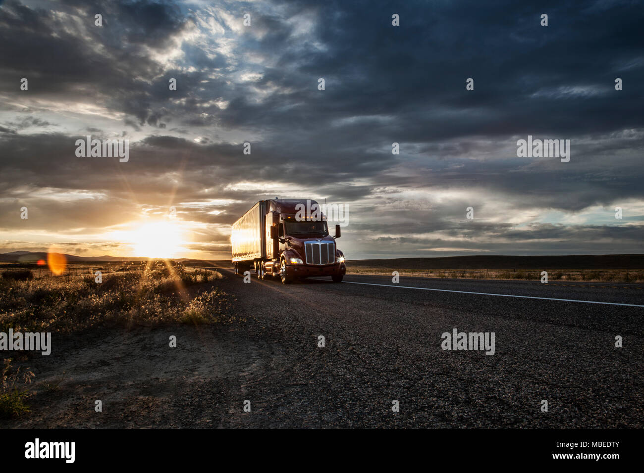3/4 front view of a commercial truck on the road at sunset in eastern ...