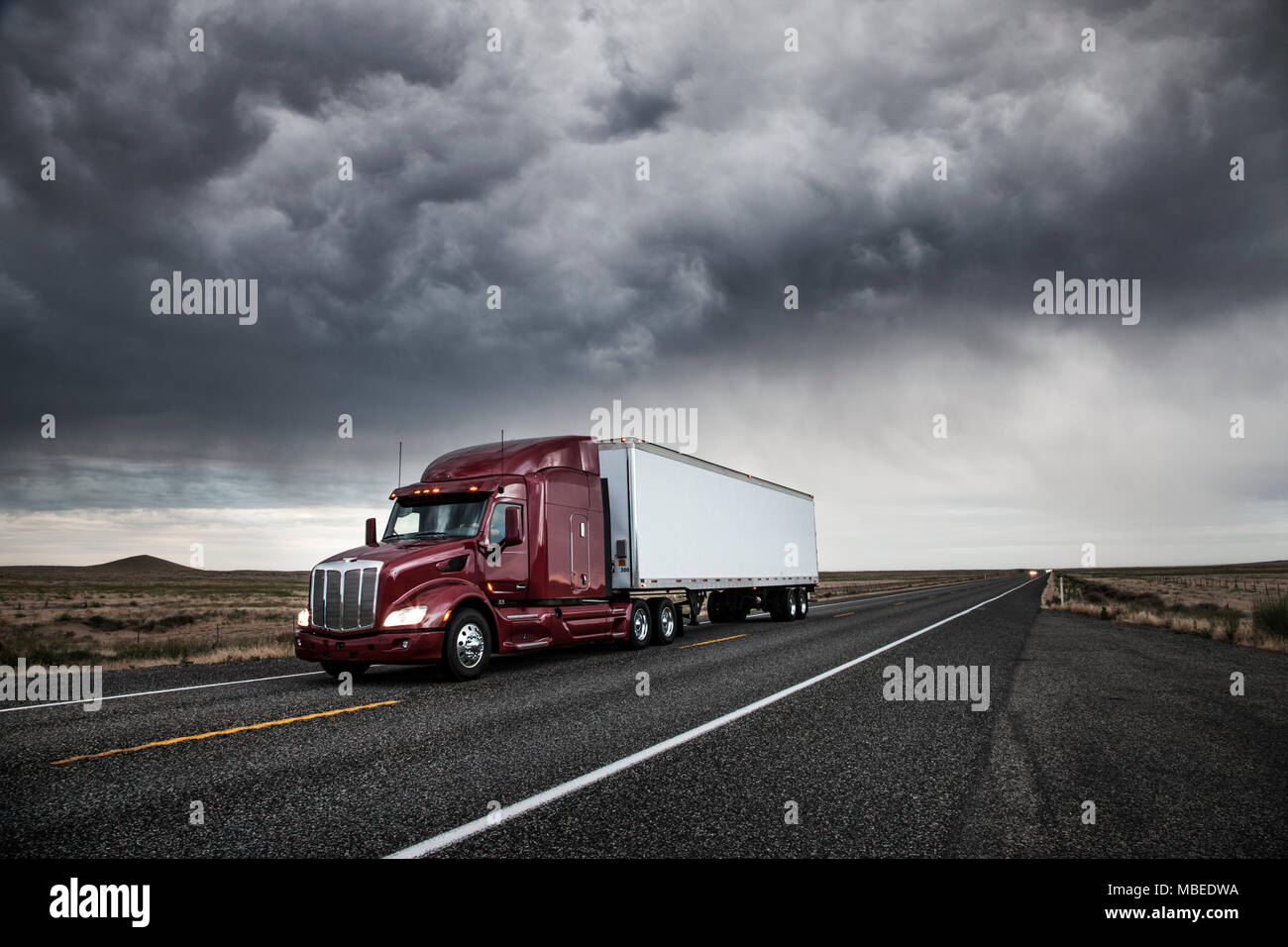 3/4 front view of a commercial truck on the road at sunset in eastern ...
