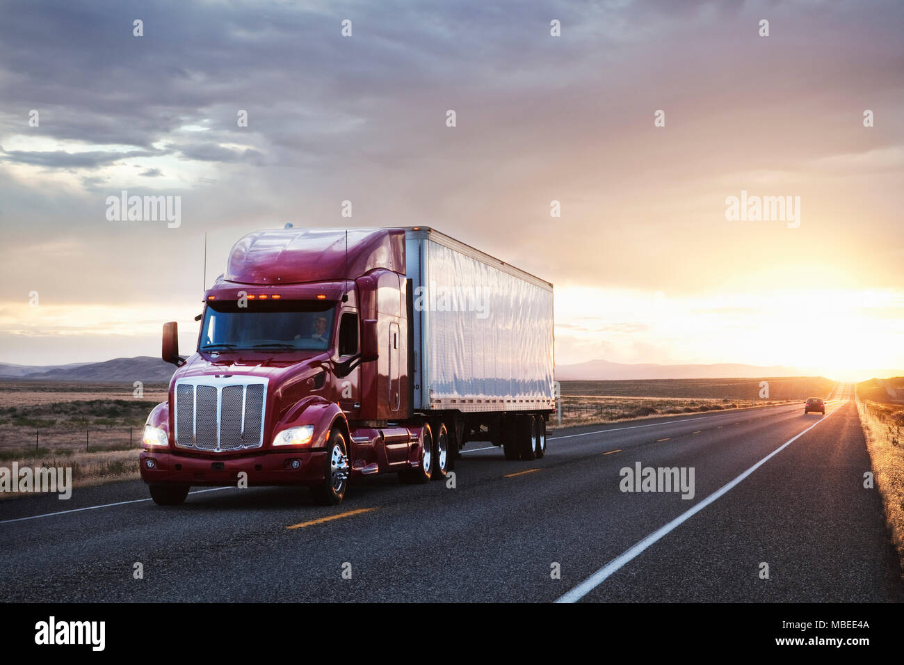 3/4 front view of a commercial truck on the road at sunset in eastern ...