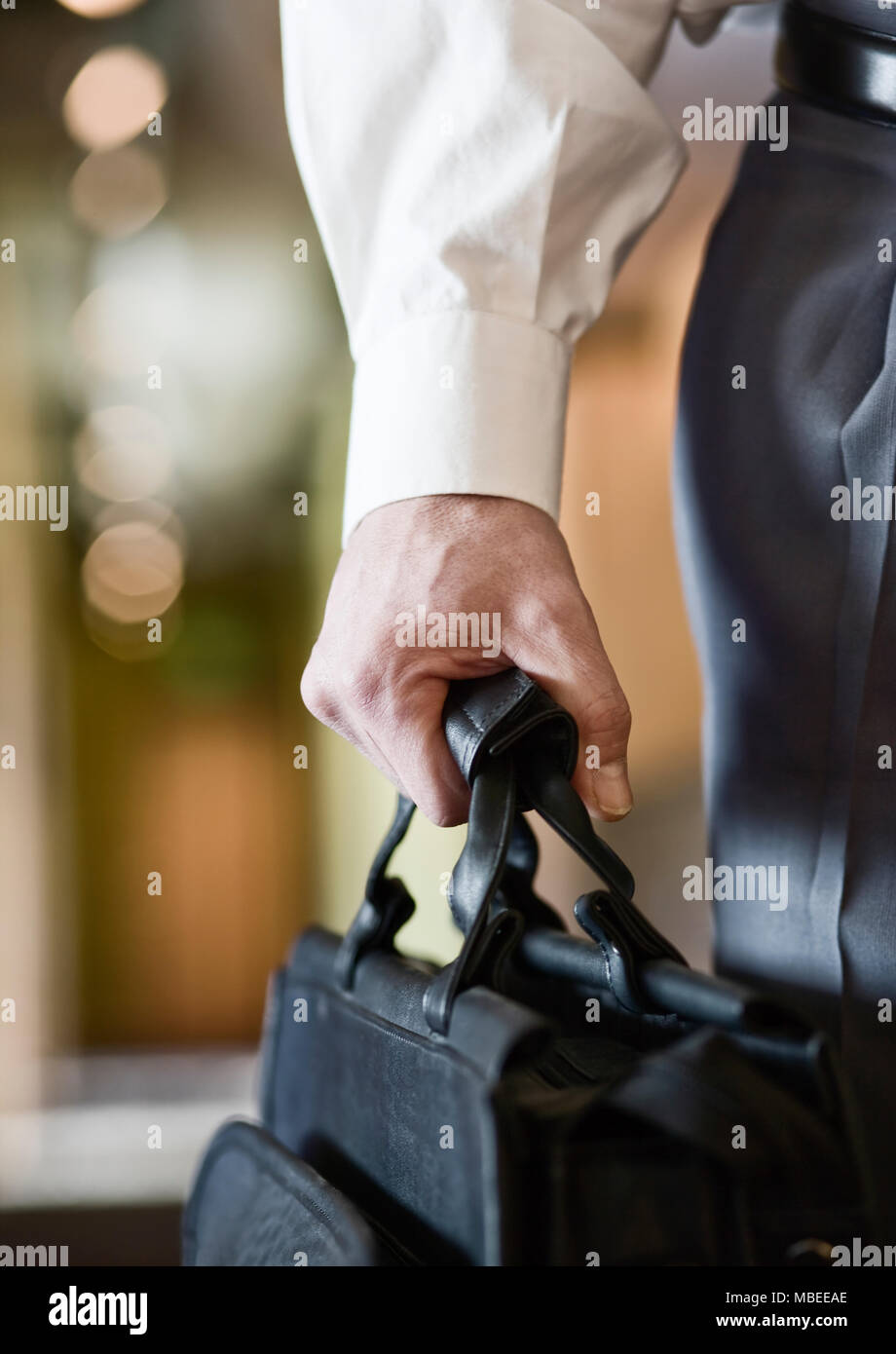 A closeup of the hand of a businessman holding a brief case Stock Photo ...