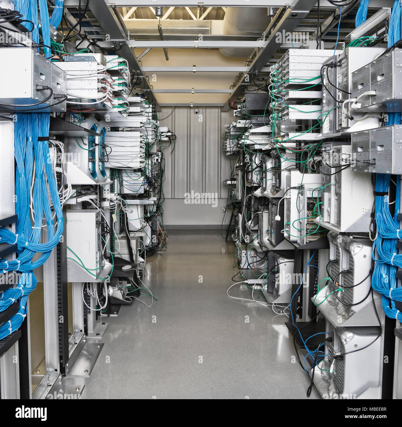 Server room aisle showing computer servers and CAT 5 cables Stock Photo ...