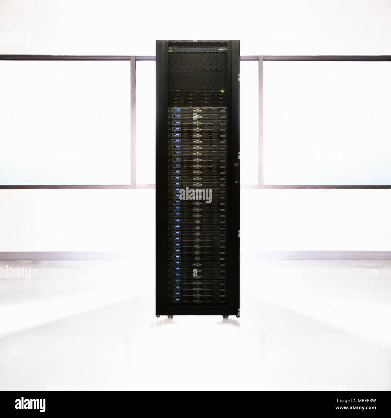 Rack housing servers in computer server farm Stock Photo - Alamy