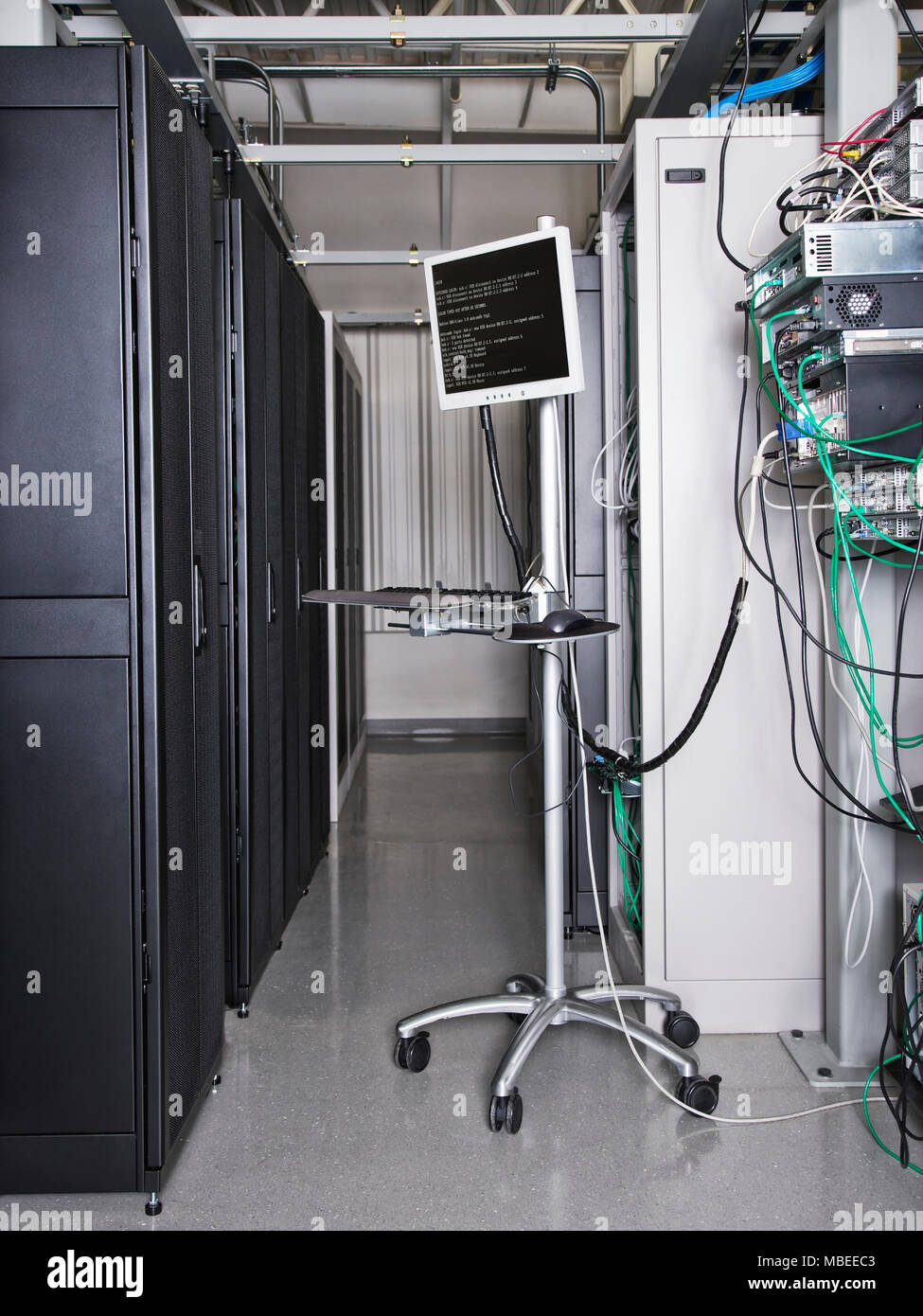 Monitor used to analyze data from servers in computer server farm Stock ...