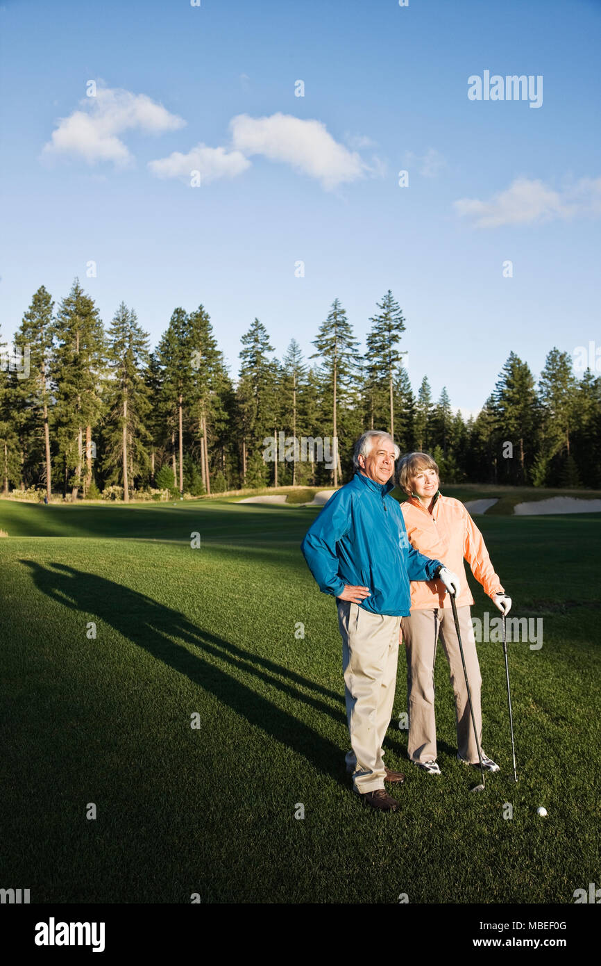 Senior golfing couple on the golf course Stock Photo - Alamy