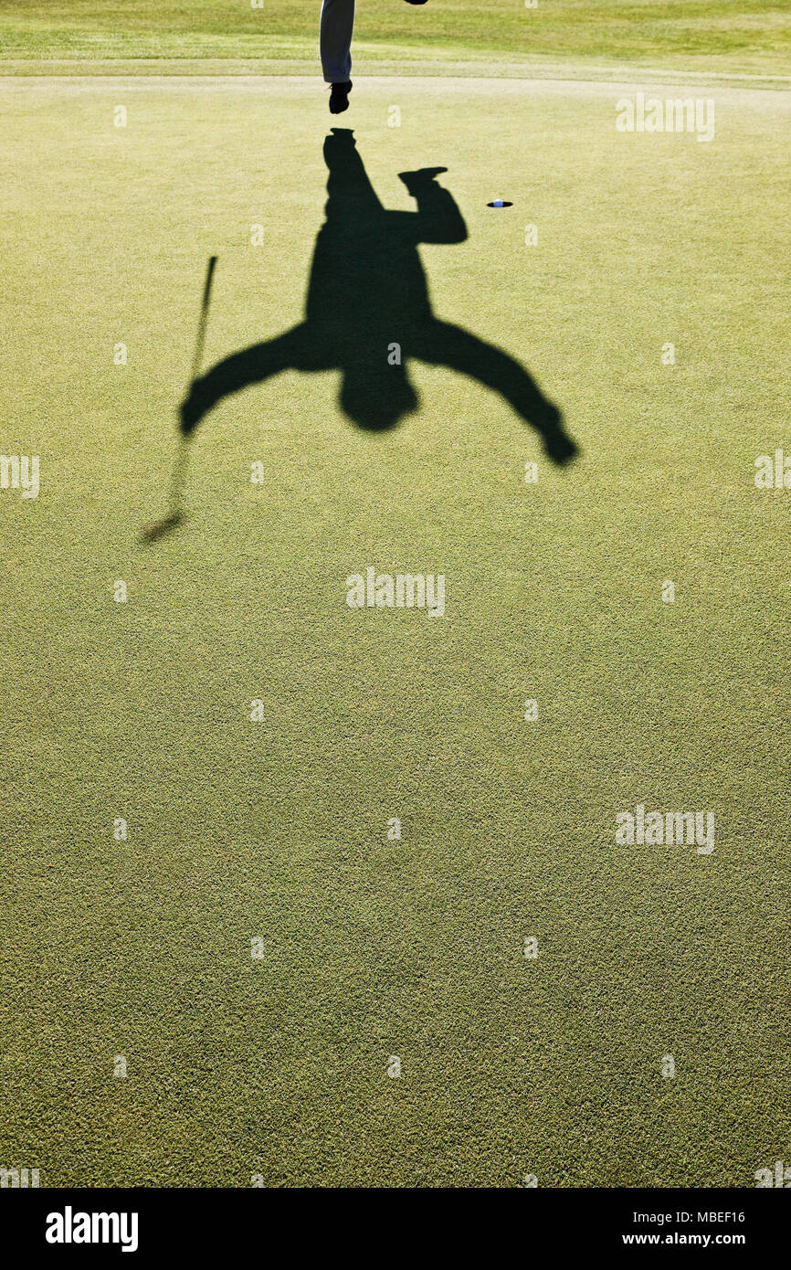 Golfer jumping at green hi-res stock photography and images - Alamy