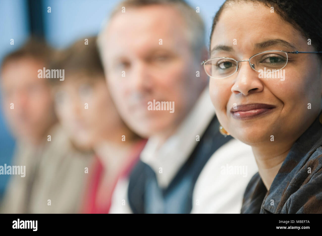 Mixed race team of business people led by a black businesswoman Stock ...