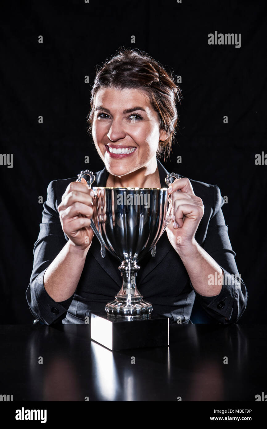 Studio portraits of caucasian woman holding props Stock Photo - Alamy