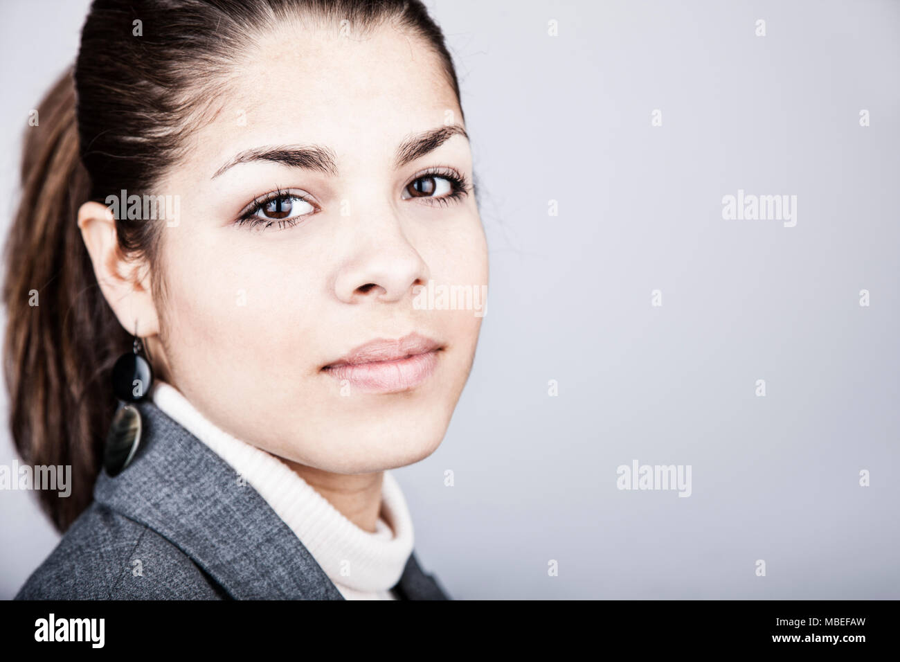 Studio portrait of a young Hispanic woman Stock Photo - Alamy