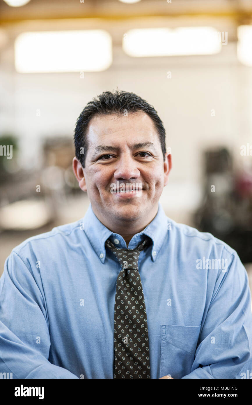 Hispanic man manager in a sheet metal factory Stock Photo - Alamy