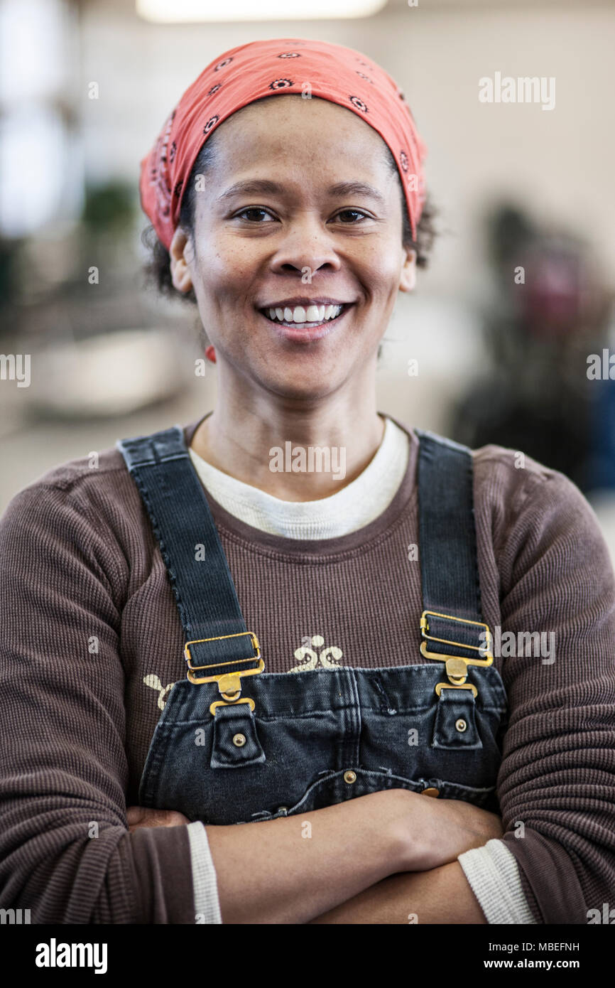 Black woman factory worker in a sheet metal factory Stock Photo - Alamy