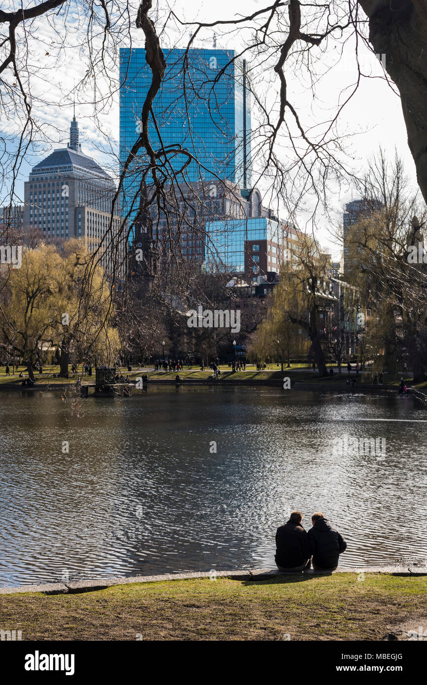 Two people sitting in The Boston Commons Stock Photo - Alamy