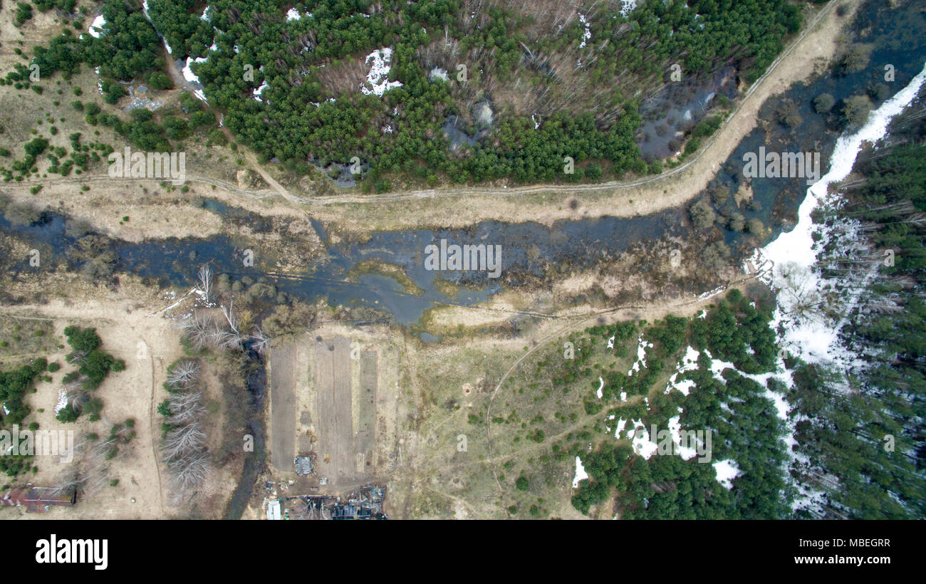The landscape of green forest and water spill from the river. The ...