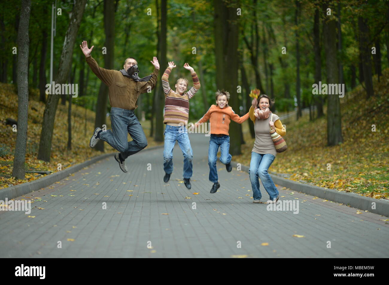 Beautiful woman jumping in forest hi-res stock photography and images ...