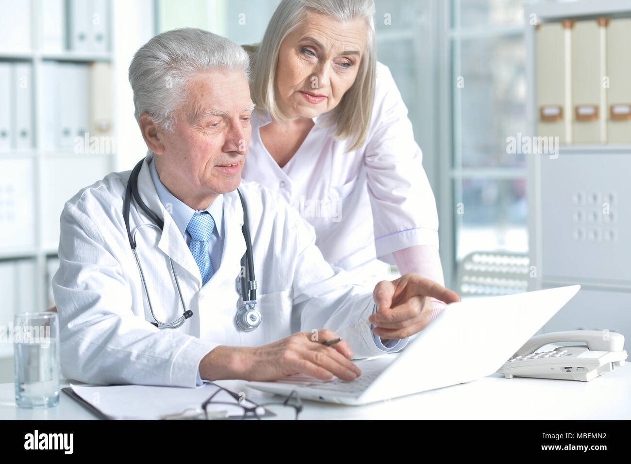 male and female doctors working Stock Photo - Alamy