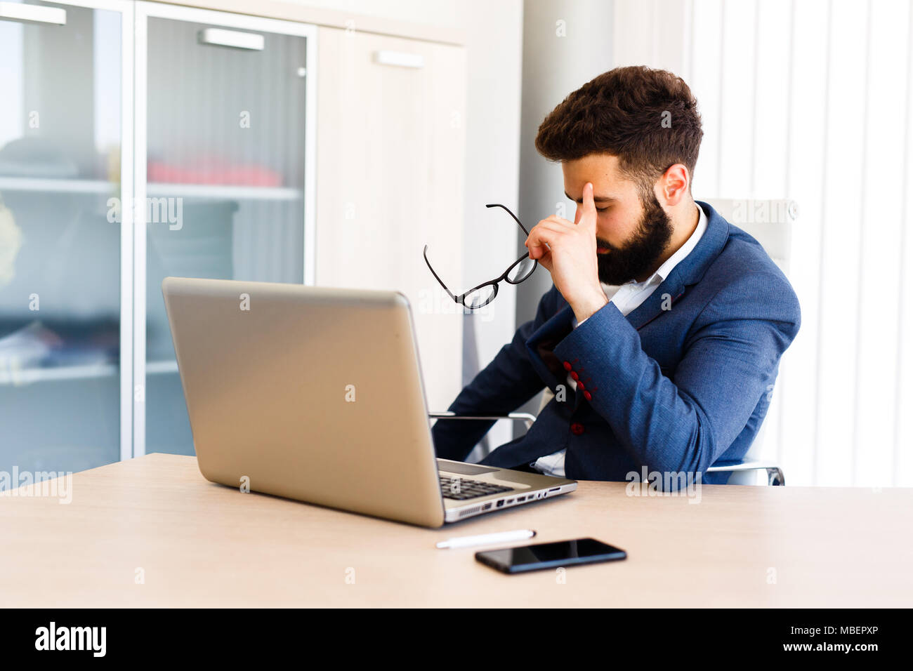 Young Businessman Suffering Of Mobbing At Work Stock Photo - Alamy